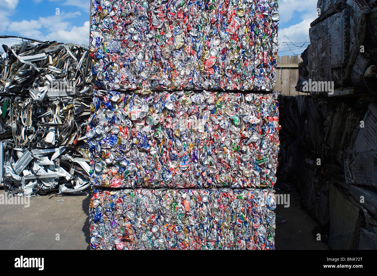 Three bales of crushed aluminum cans ready for recycling and transport ...