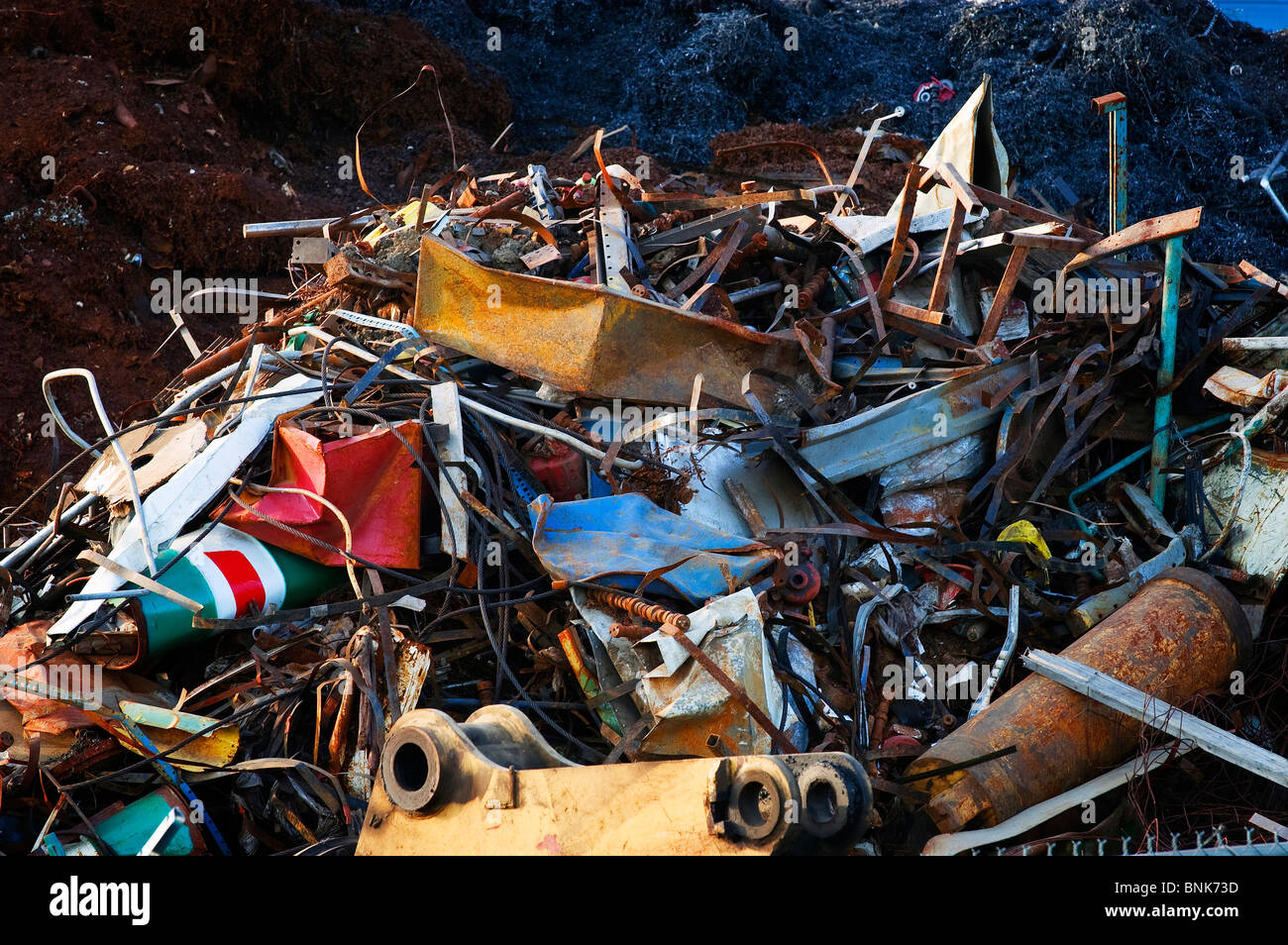 Various scrap metal piled high and ready for crushing, separating, and ...
