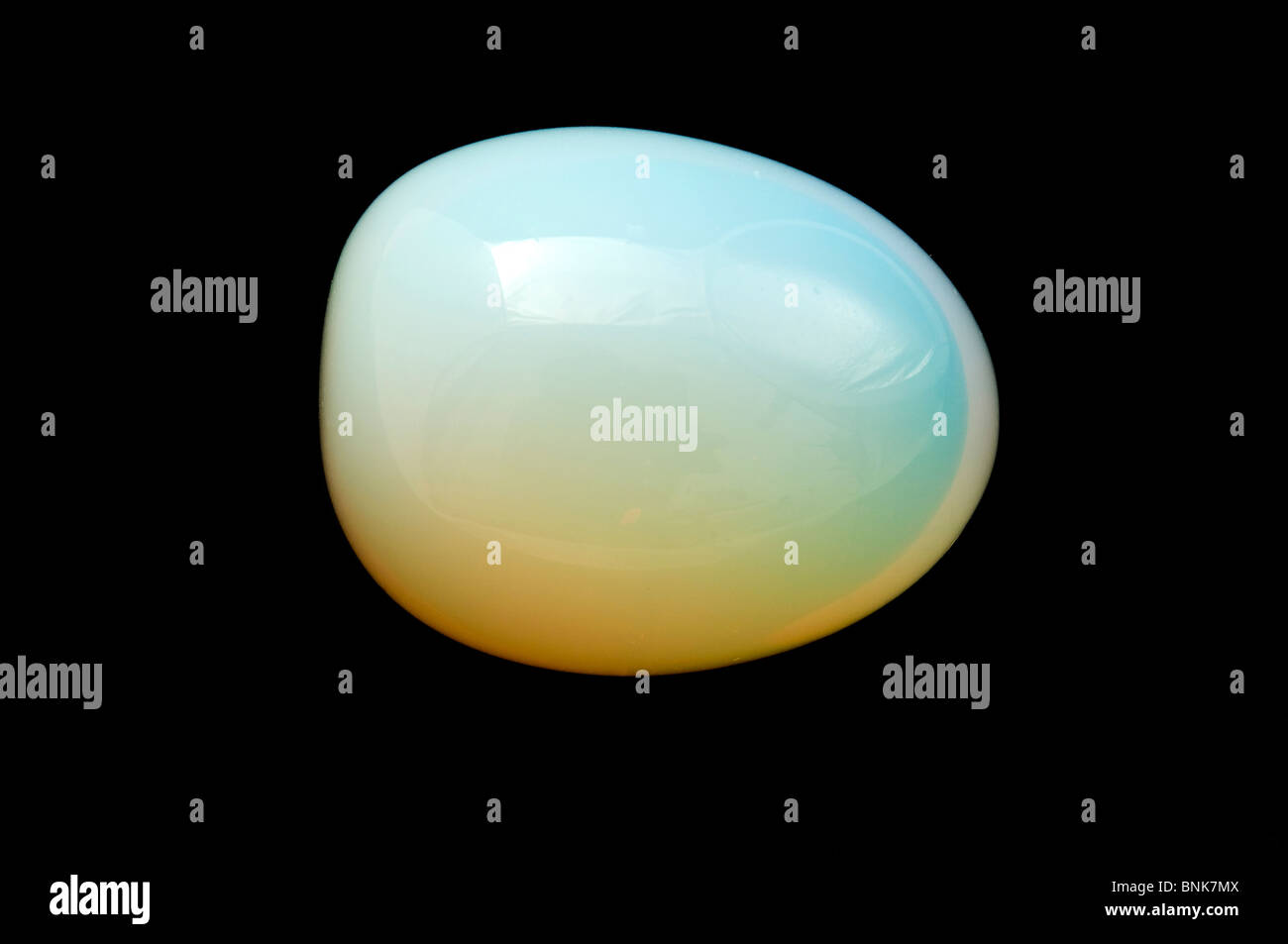 Opal on a black background Stock Photo - Alamy