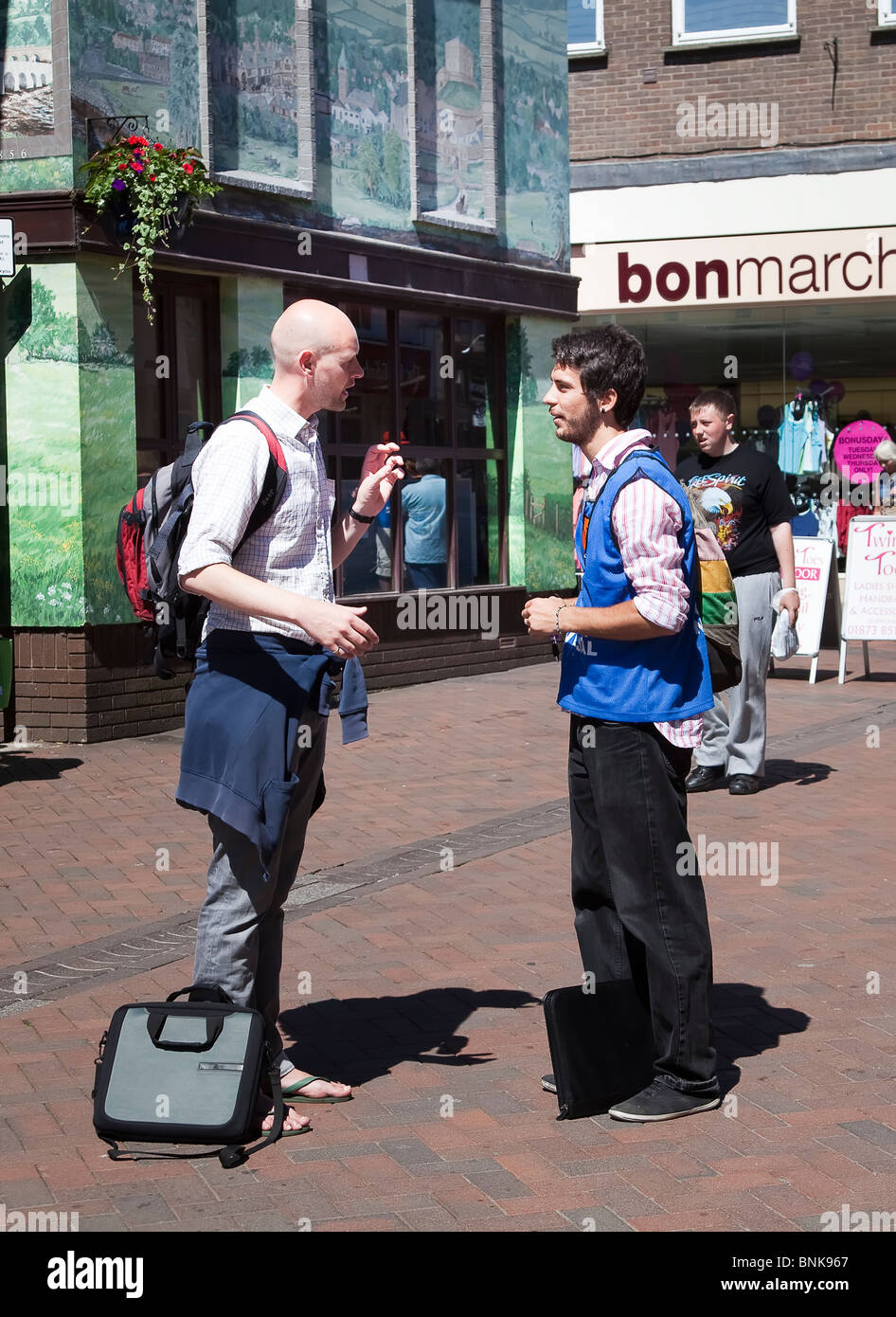 Charity collector chugger in street Abergavenny Wales UK Stock Photo ...