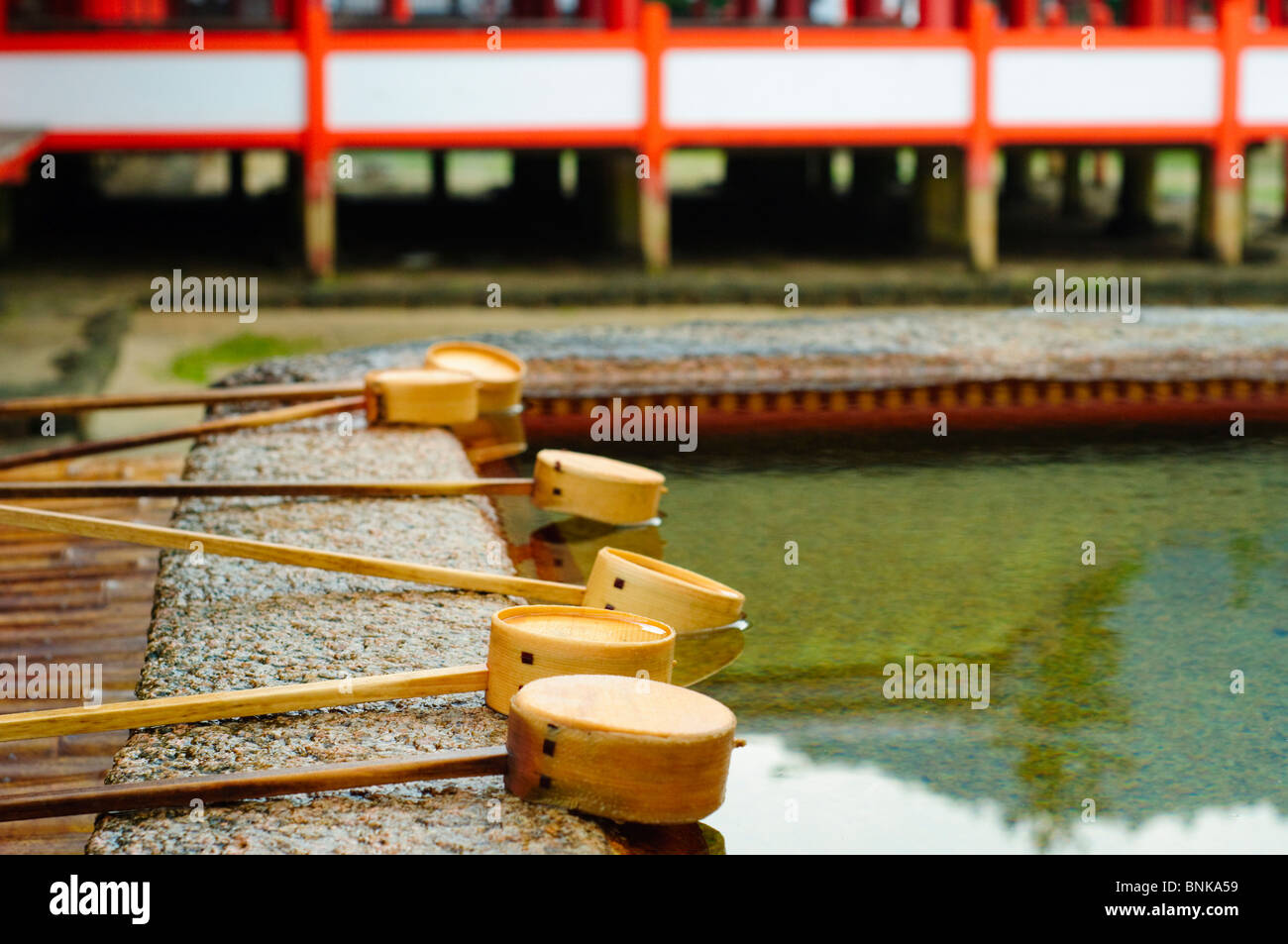 Chozu-bachi at Itsukushima Shrine, Miyajima, Honshu, Japan Stock Photo ...