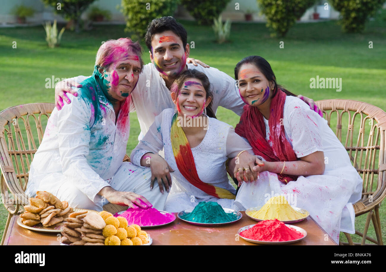 Family celebrating Holi Stock Photo - Alamy