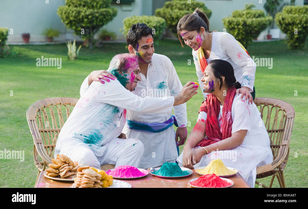 Family celebrating Holi Stock Photo - Alamy
