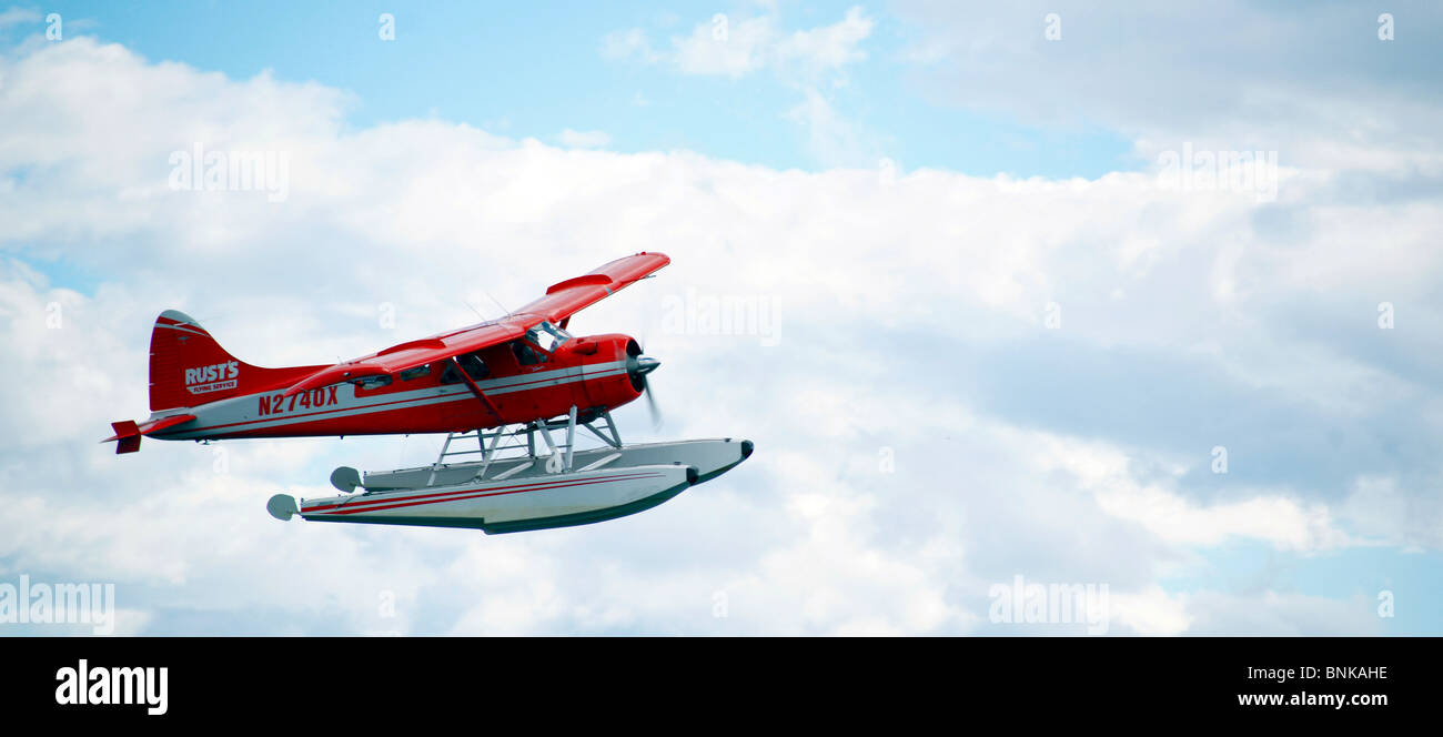 A pontoon plane in the Chugach Mountains of Alaska near Lake Hood Stock ...