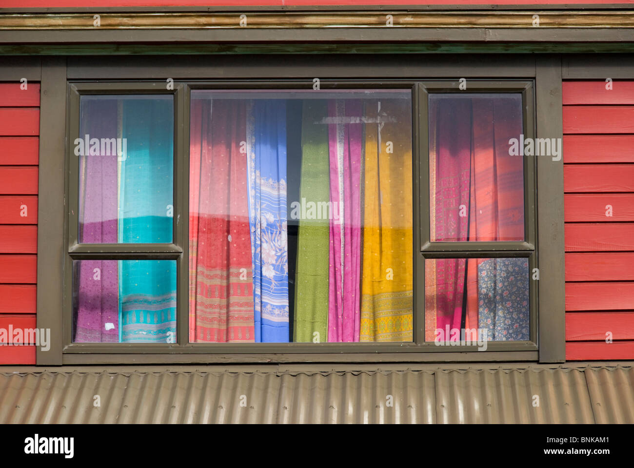 Coloured curtains in window of red building, Newtown, Wellington, North ...