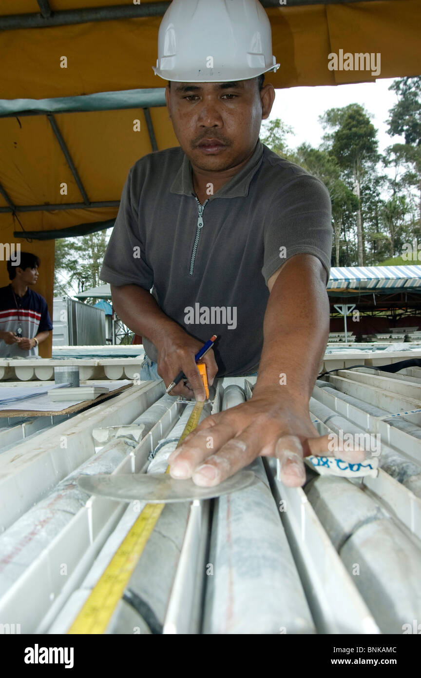 Filipino geologist studies core samples from drilling world's largest ...