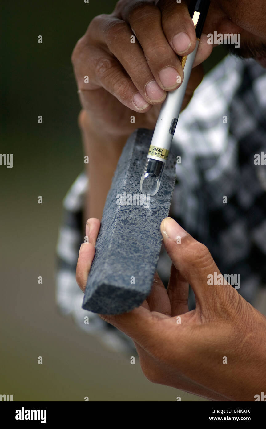 Filipino geologist studies core samples from drilling world's largest ...