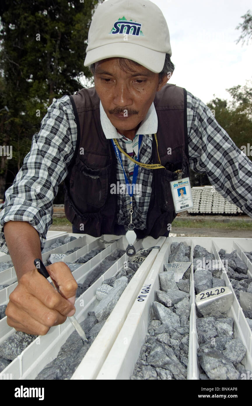 Filipino geologist studies core samples from drilling world's largest ...