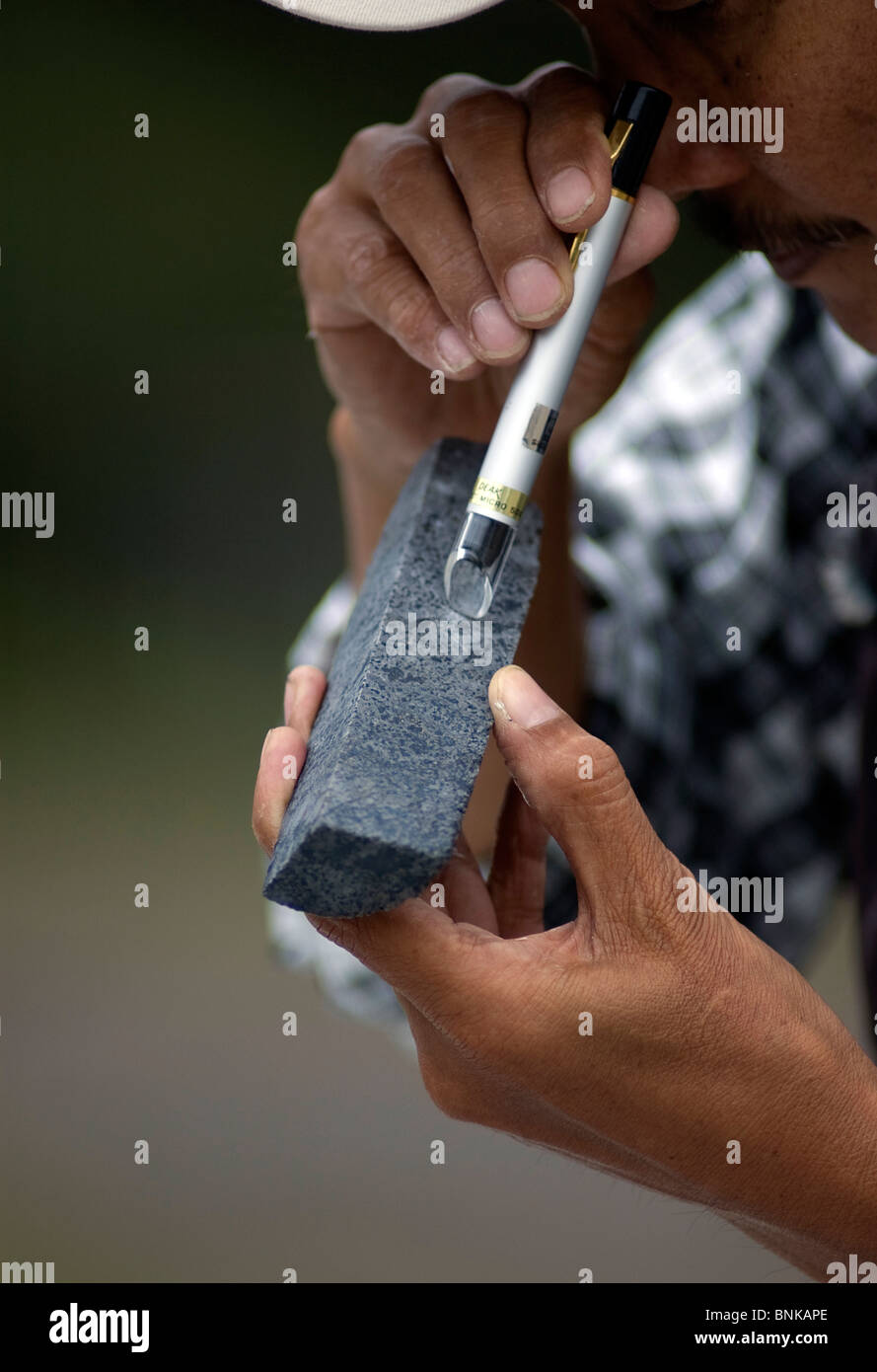 Filipino geologist studies core samples from drilling world's largest ...