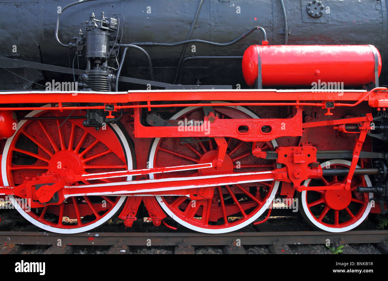 Steam engine red steel wheels and propulsion mechanism Stock Photo - Alamy