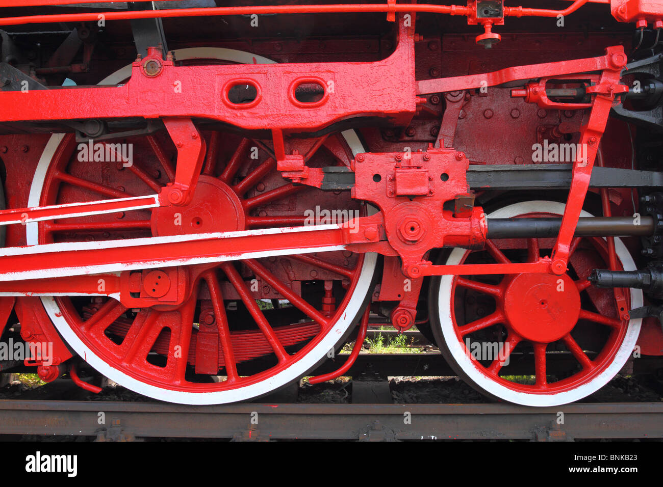 Steam engine red steel wheels and propulsion mechanism Stock Photo - Alamy