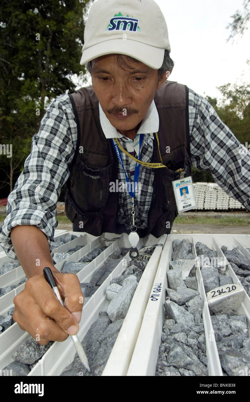 Filipino geologist studies core samples from drilling world's largest ...