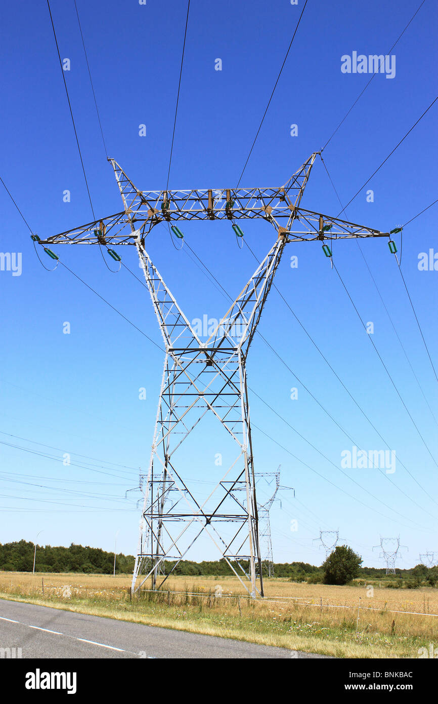 electric pylon in a field or meadow Stock Photo - Alamy