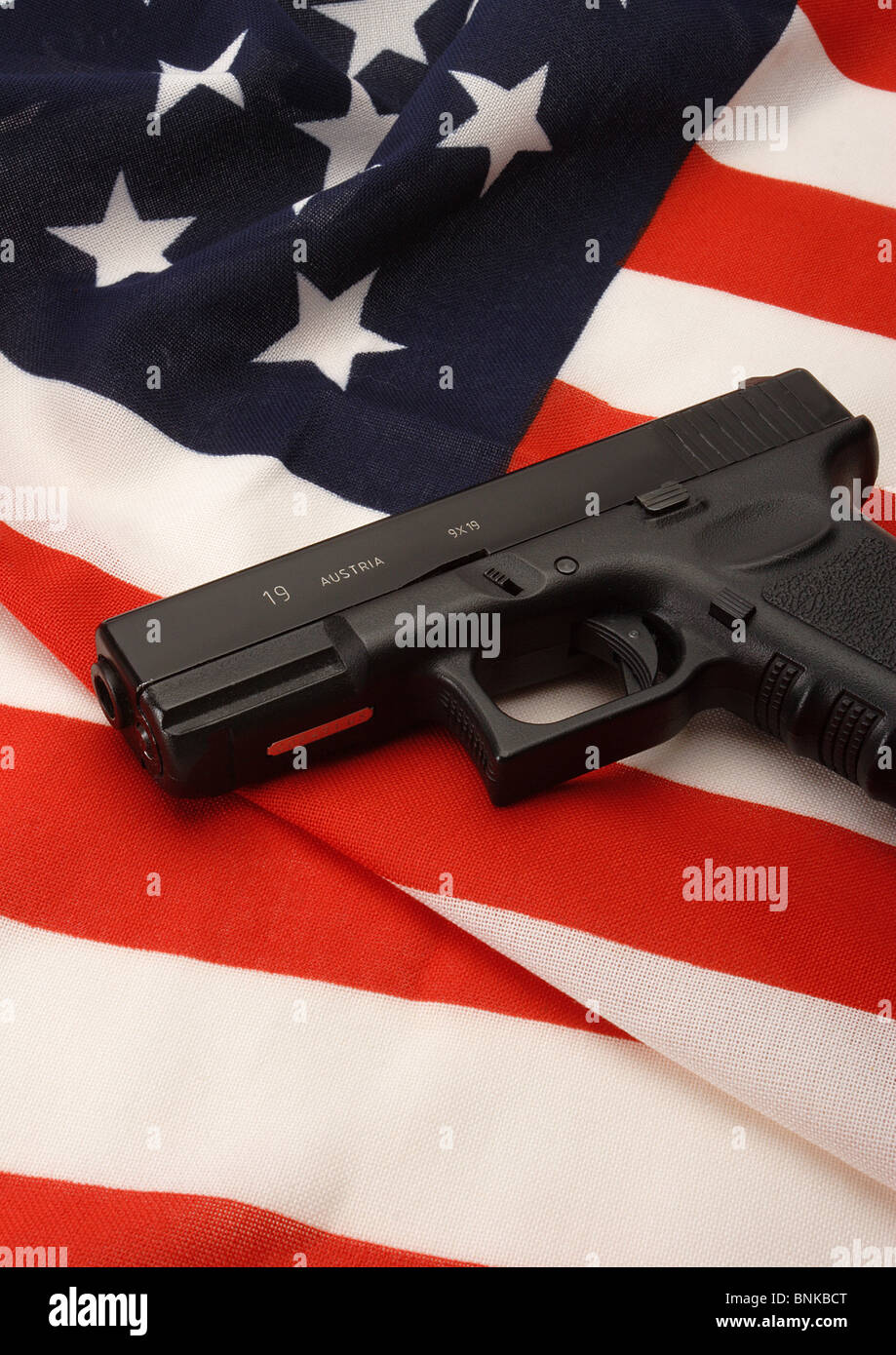 A handgun on an American flag Stock Photo - Alamy
