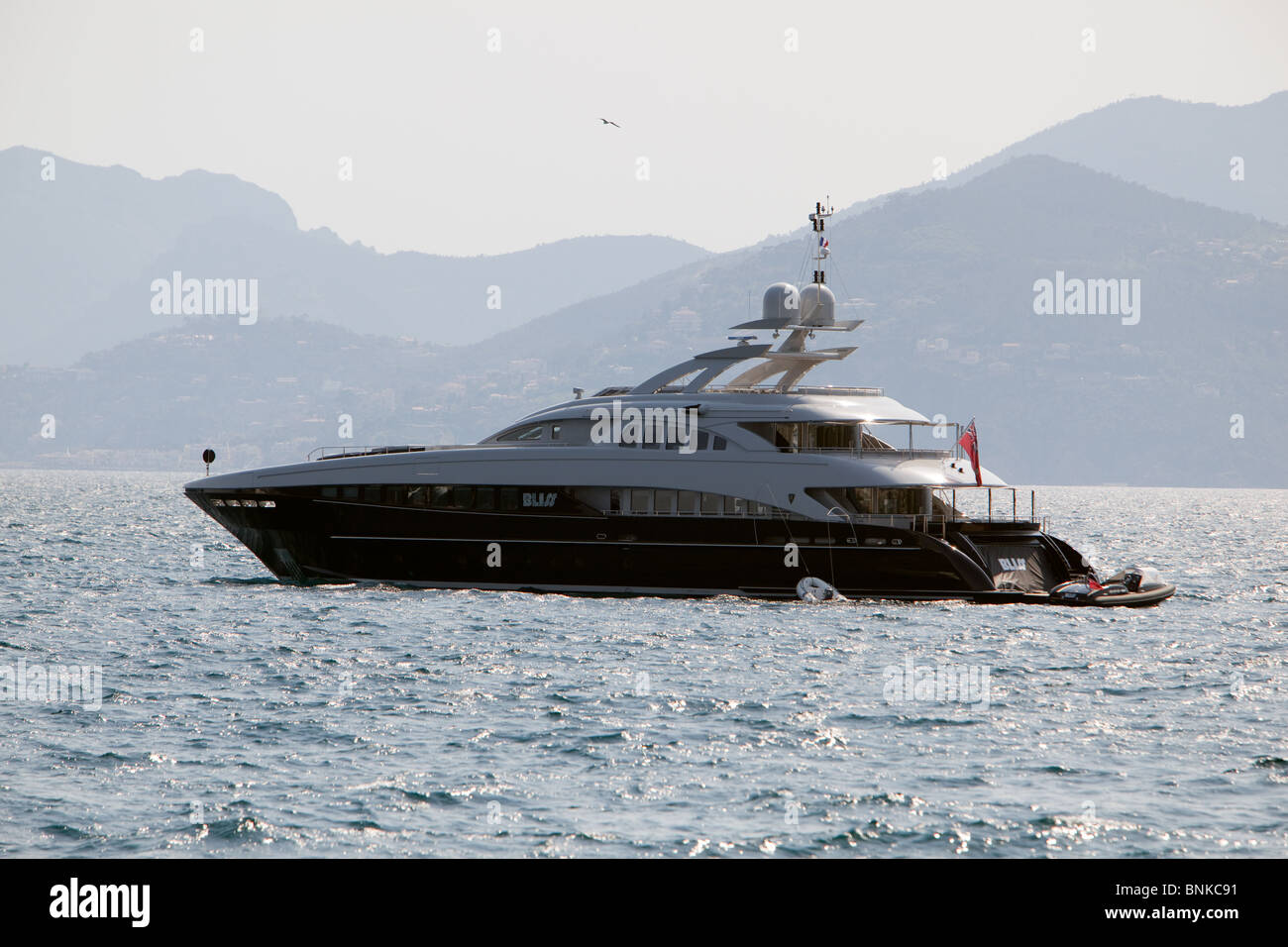 Luxury power yacht at anchor.Cannes Stock Photo - Alamy