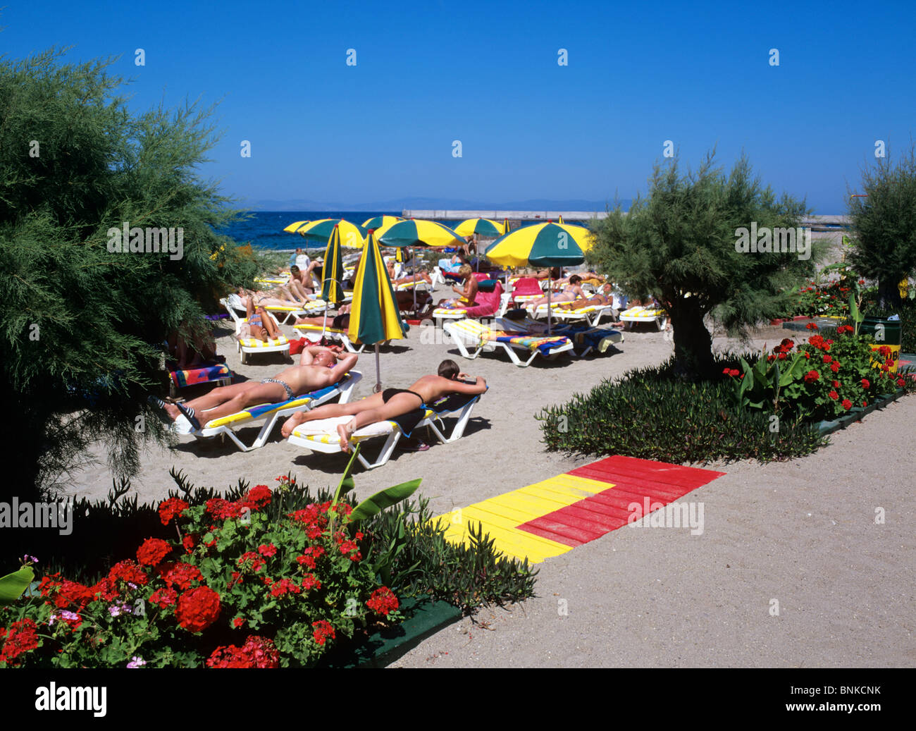 Scene on Kos Town beach Stock Photo - Alamy