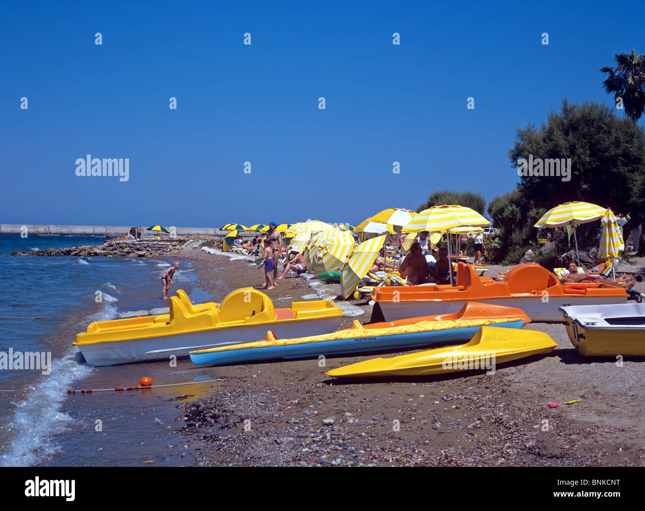 Scene on Kos Town beach Stock Photo - Alamy