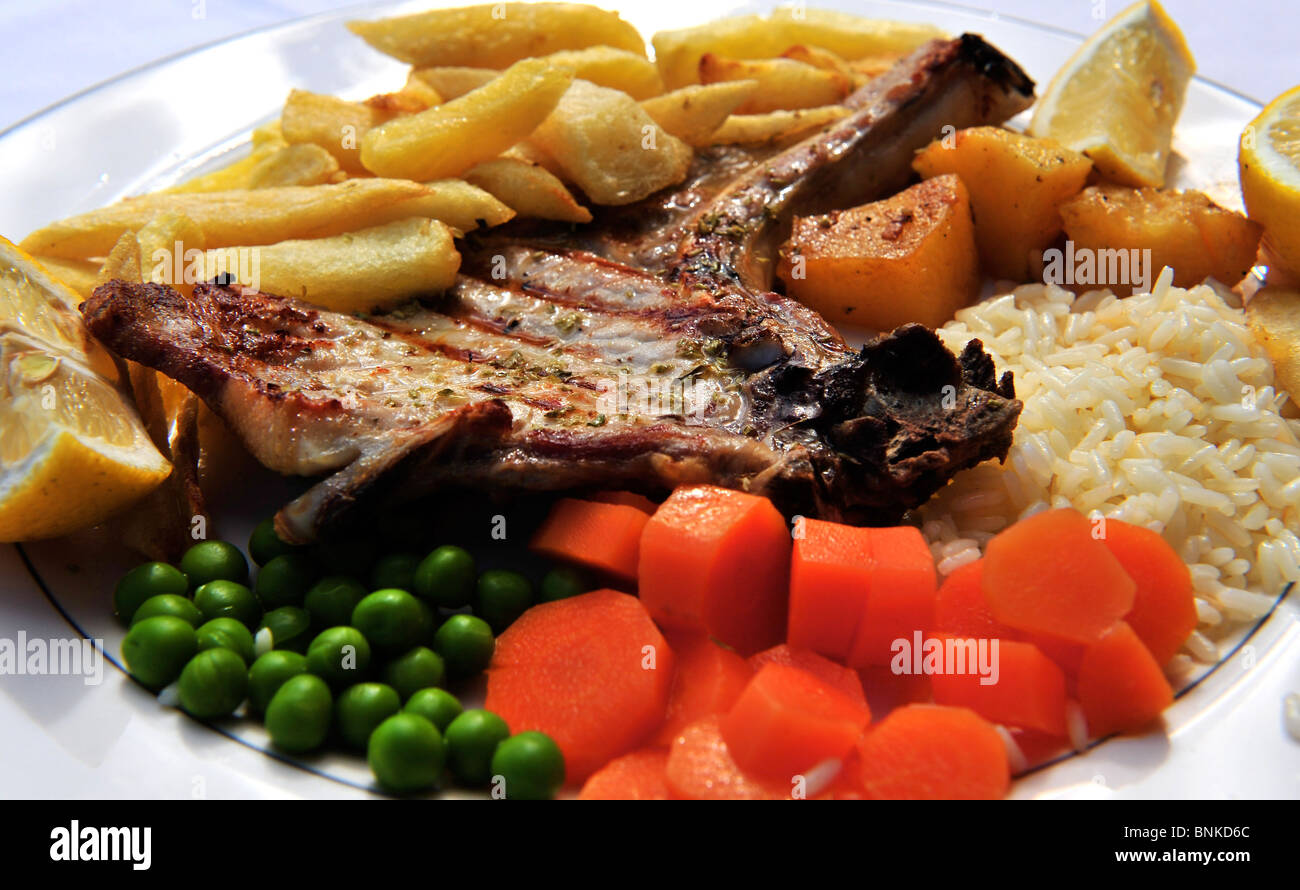 Classic Greek dinner of Hirines Brizoles - or seasoned pork chop Stock ...