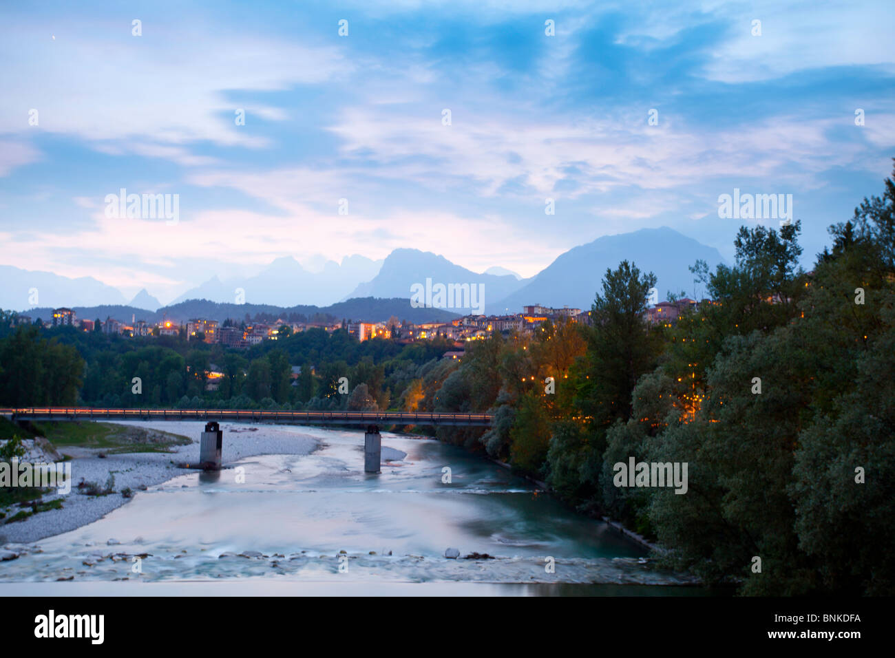 The mountain town of belluno captured at sunset with the dolomite ...
