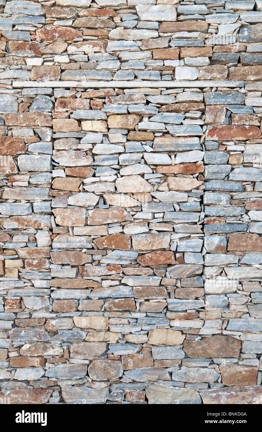 Filled in window on a stone house in Greece Stock Photo - Alamy