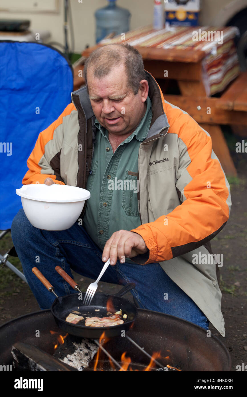 Man cooking bacon on hi-res stock photography and images - Alamy