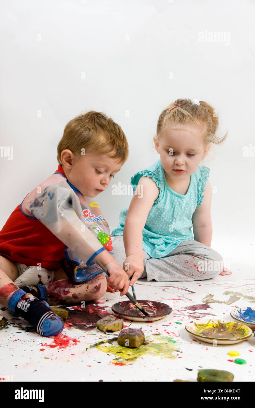 Portrait of Two Toddlers Boy and Girl Painting Together, Best Friends ...
