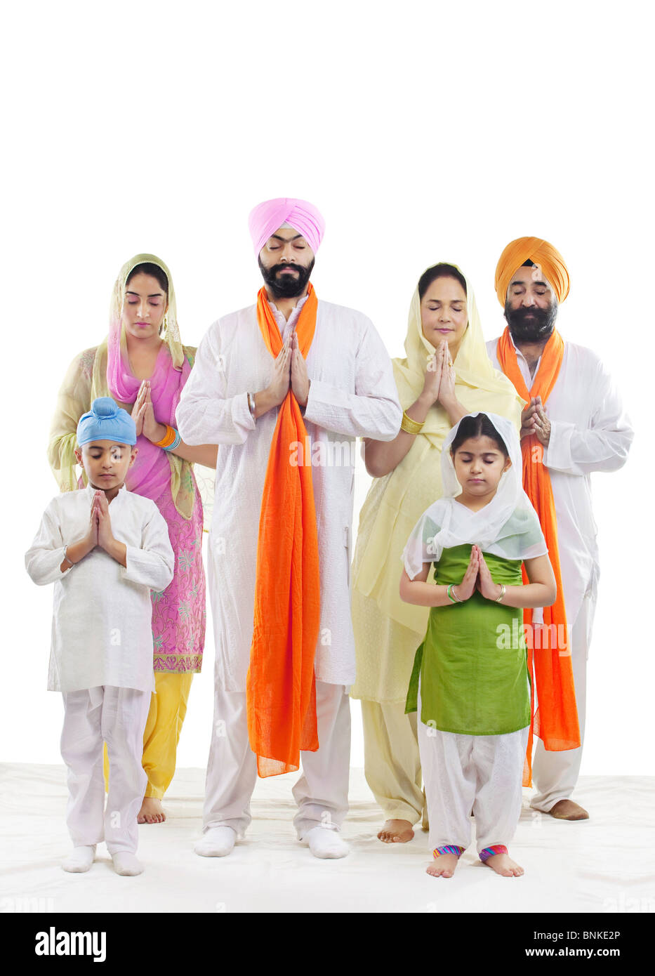 Sikh family praying Stock Photo - Alamy