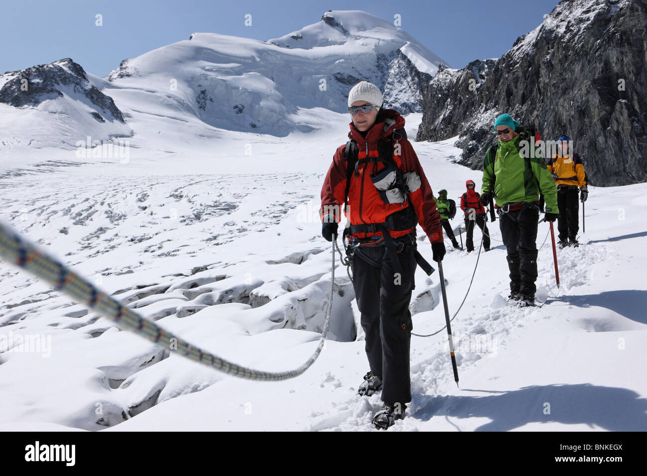 Winter mountaineering group rope glacier ice moraine mountain mountains ...