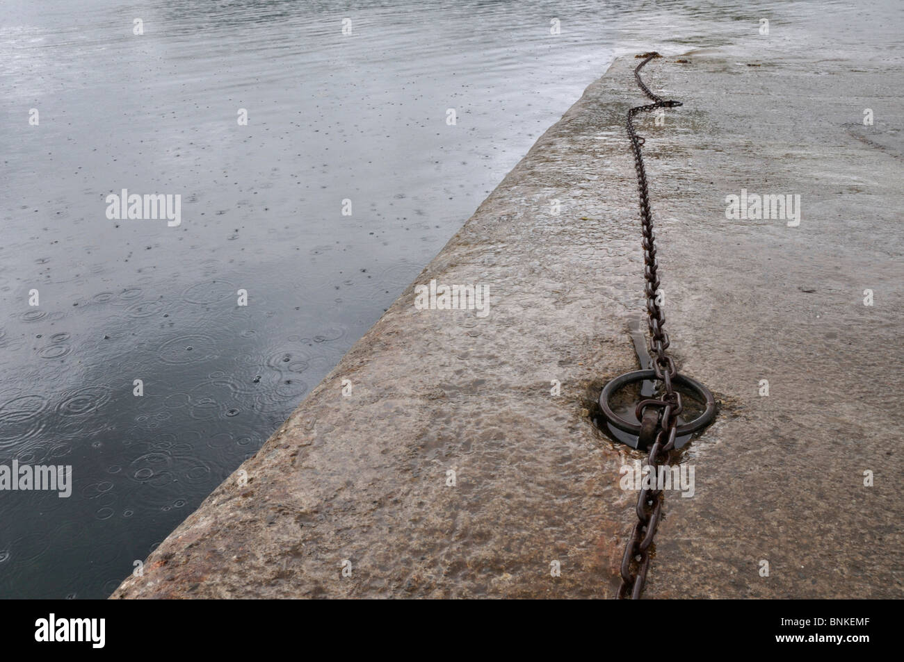 Metal chain on jetty, Kerrera, Scotland Stock Photo - Alamy
