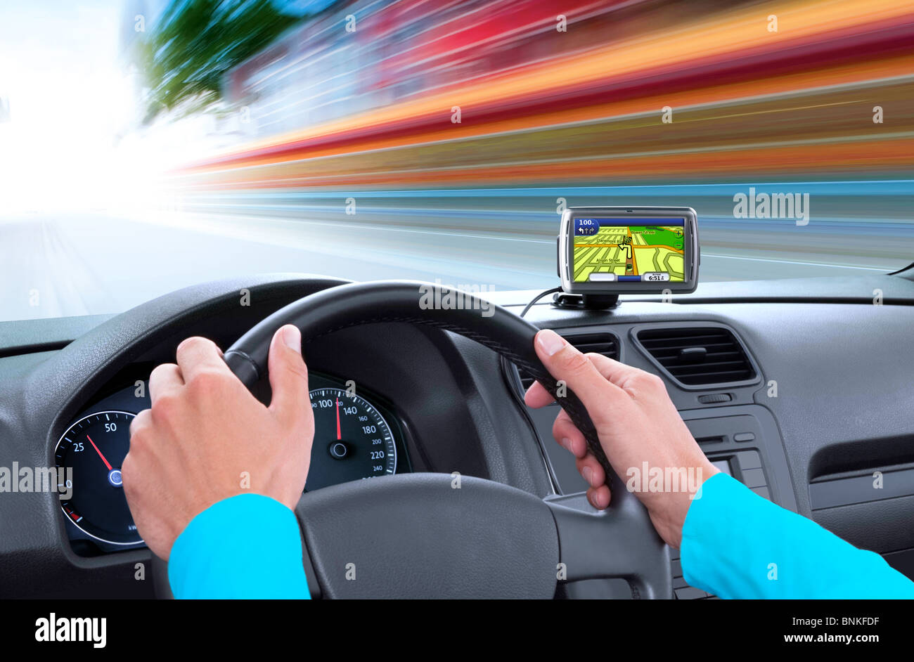 navigator on dashboard and hands of driver that sits on driver's seat ...