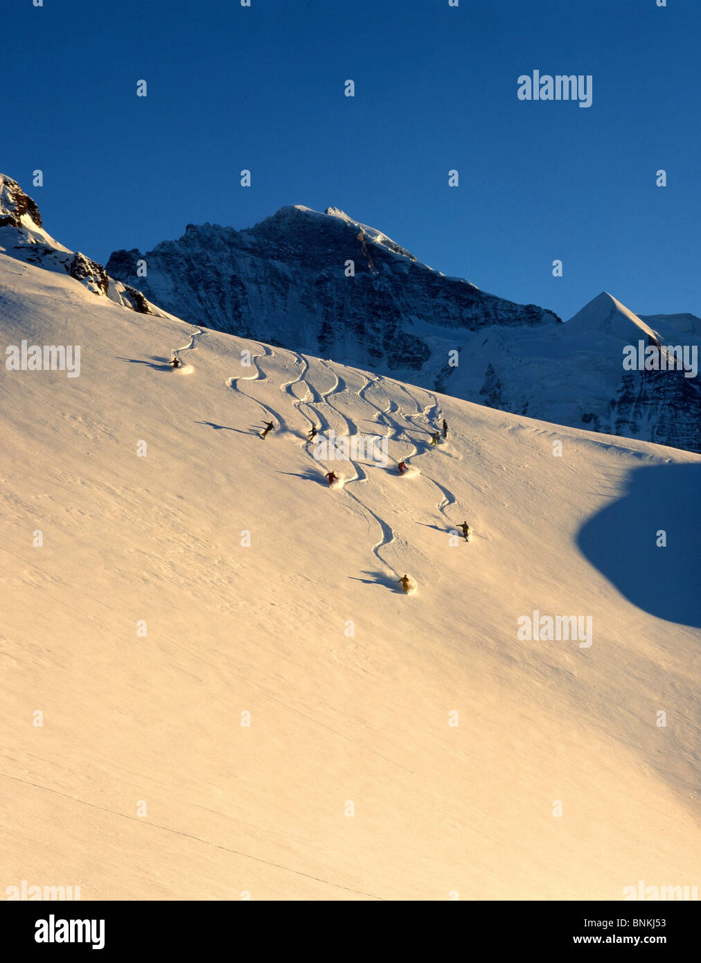 Switzerland winter sports skiing slope inclination deep snow tracks ...