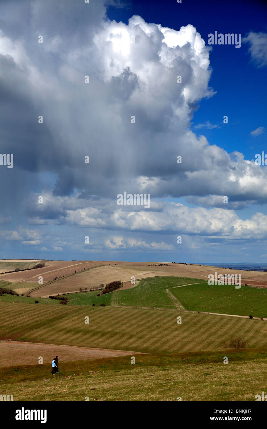 Walkers overlooking the village of Findon South Downs National Park ...