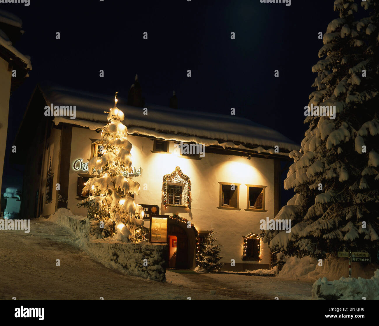 Switzerland Saint Moritz darkness evening outside lighting trees snow ...