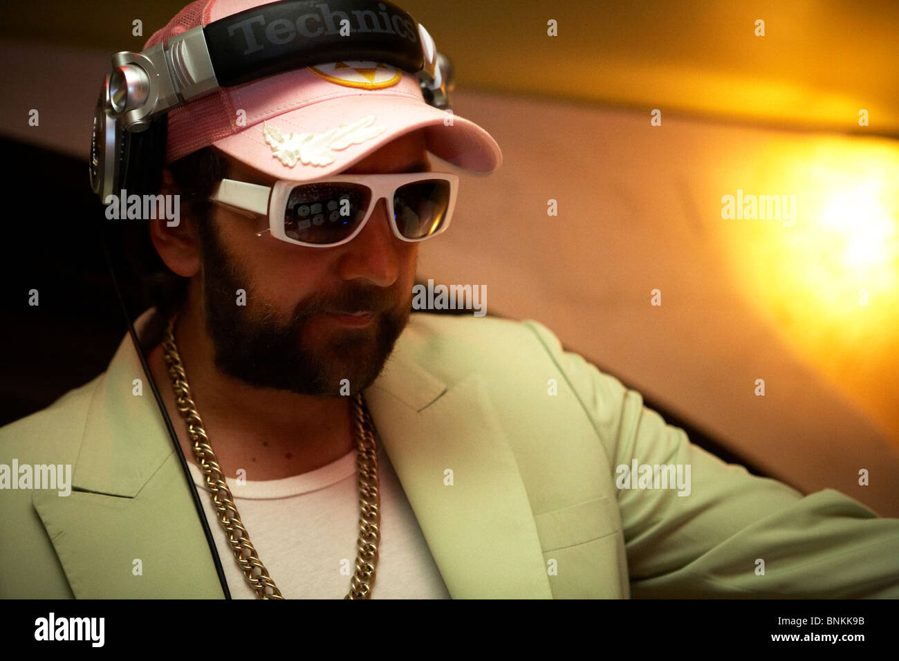 A London party DJ dressed in white with a retro look Stock Photo - Alamy