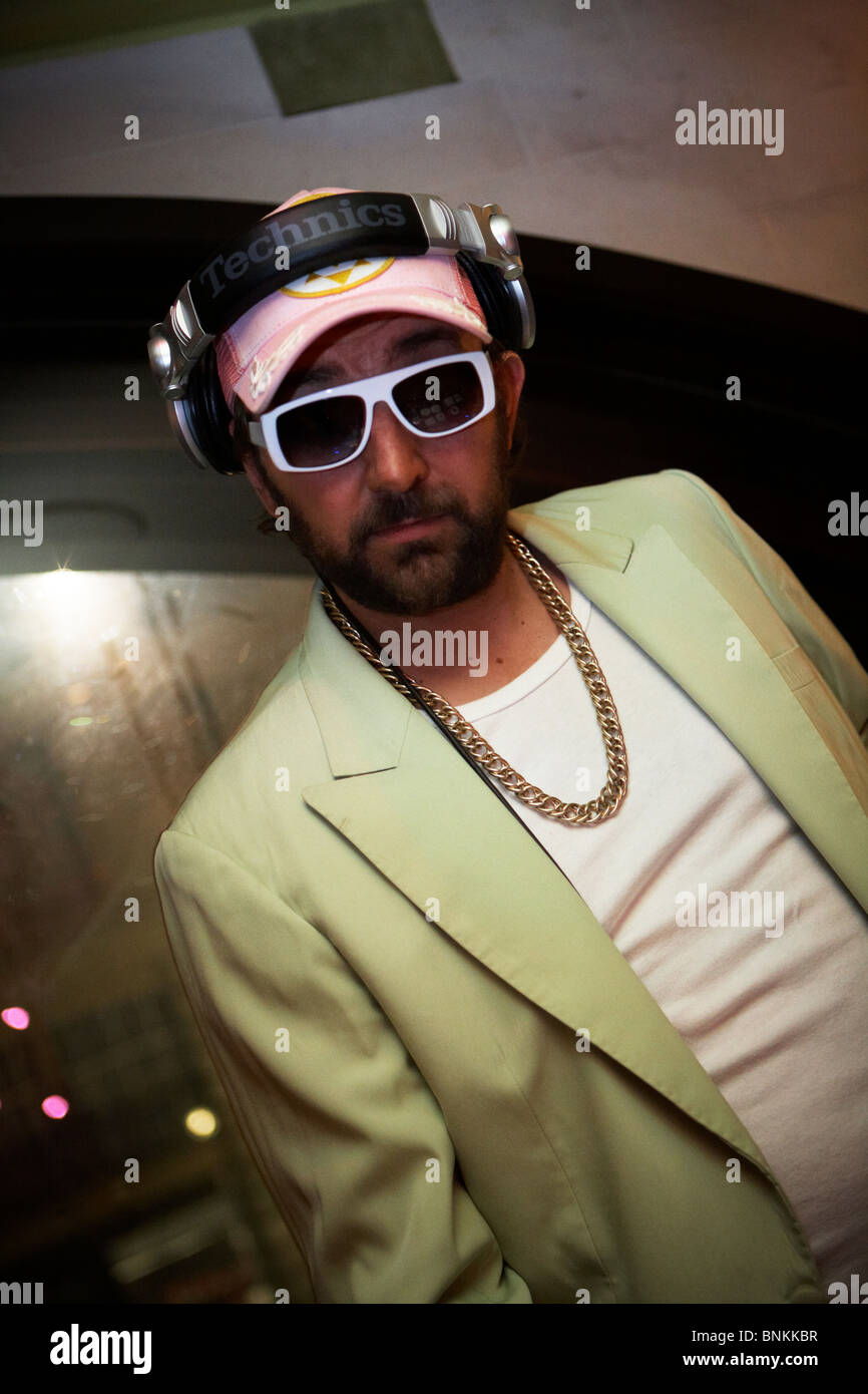 A London party DJ dressed in white with a retro look Stock Photo - Alamy