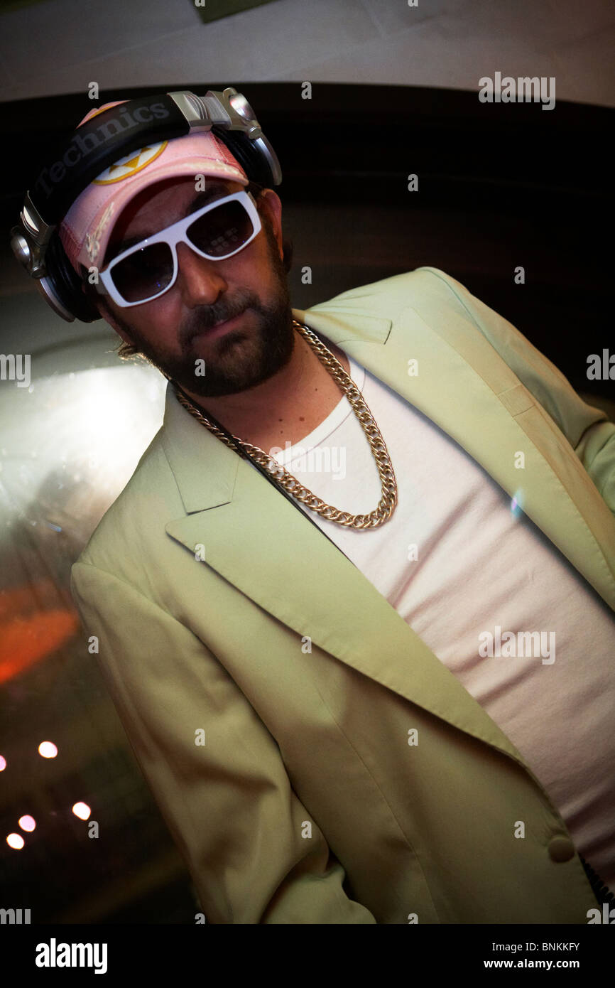 A London party DJ dressed in white with a retro look Stock Photo - Alamy