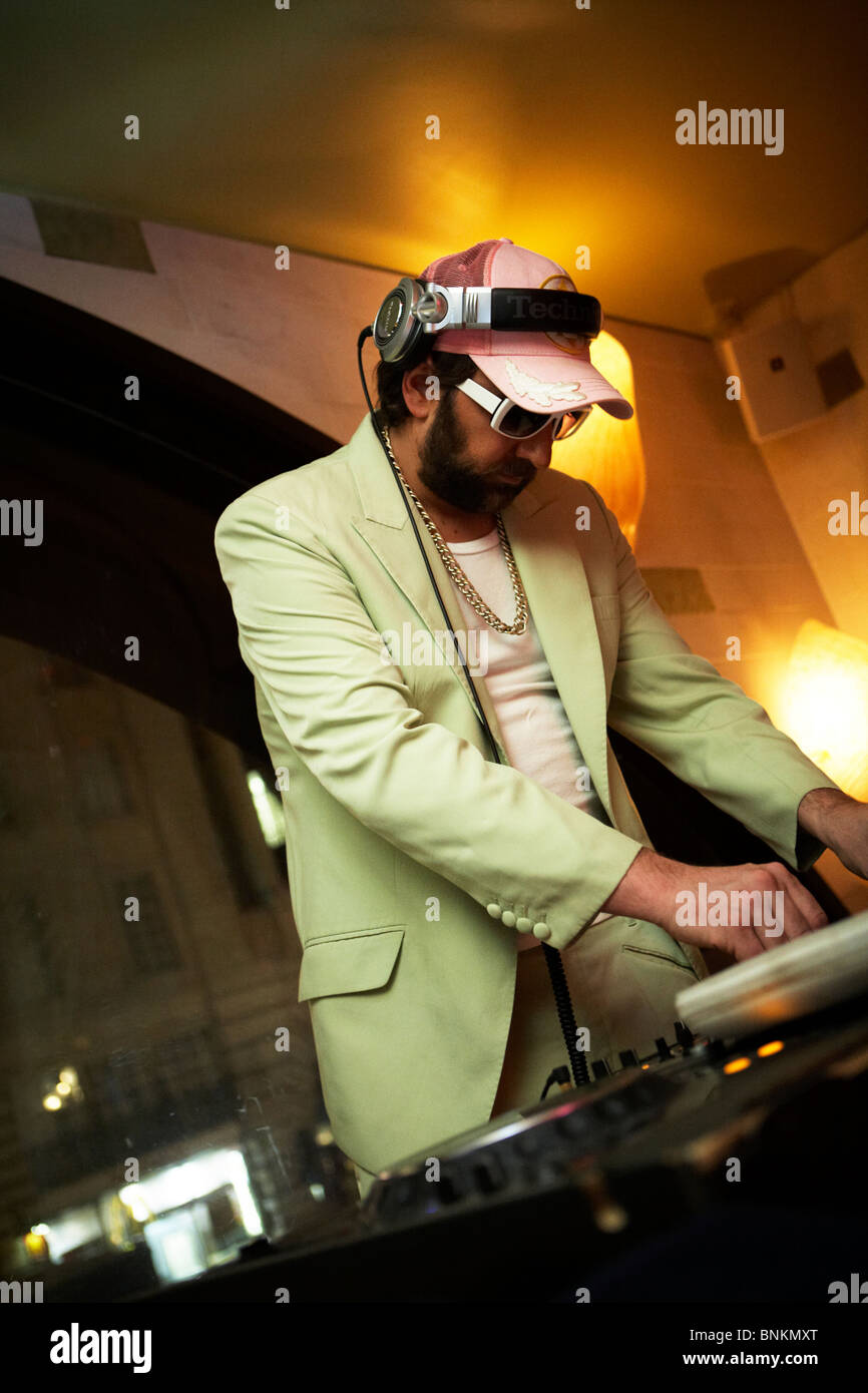 A London party DJ dressed in white with a retro look Stock Photo - Alamy