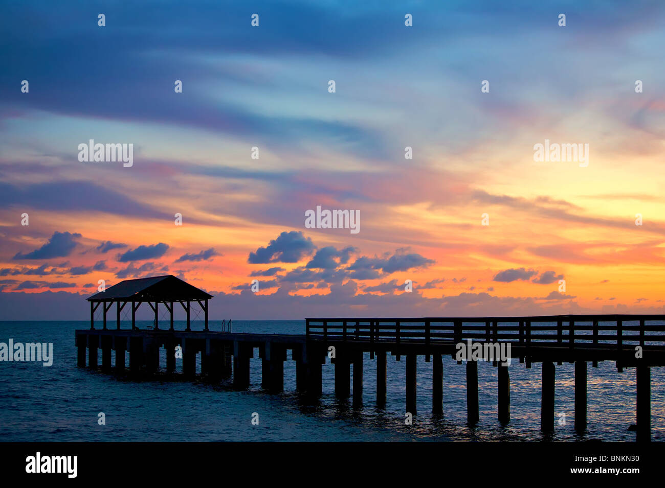 Sun Reflecting on pier in Kauai Stock Photo - Alamy
