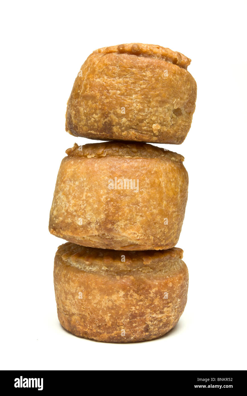 Stack of Traditional English Pork Pies from low perspective isolated ...