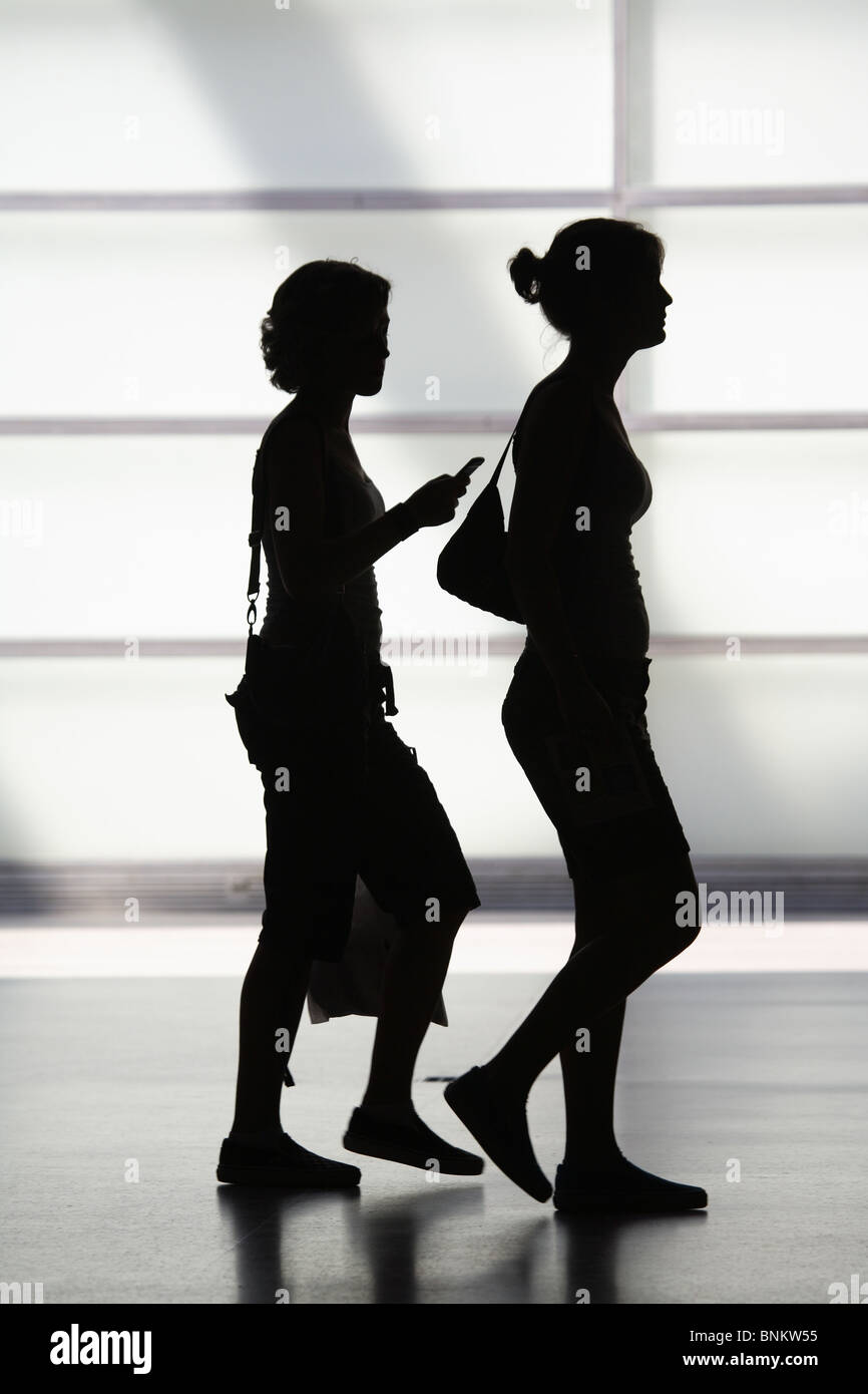 Silhouettes of two young women bnkw55 hi-res stock photography and ...
