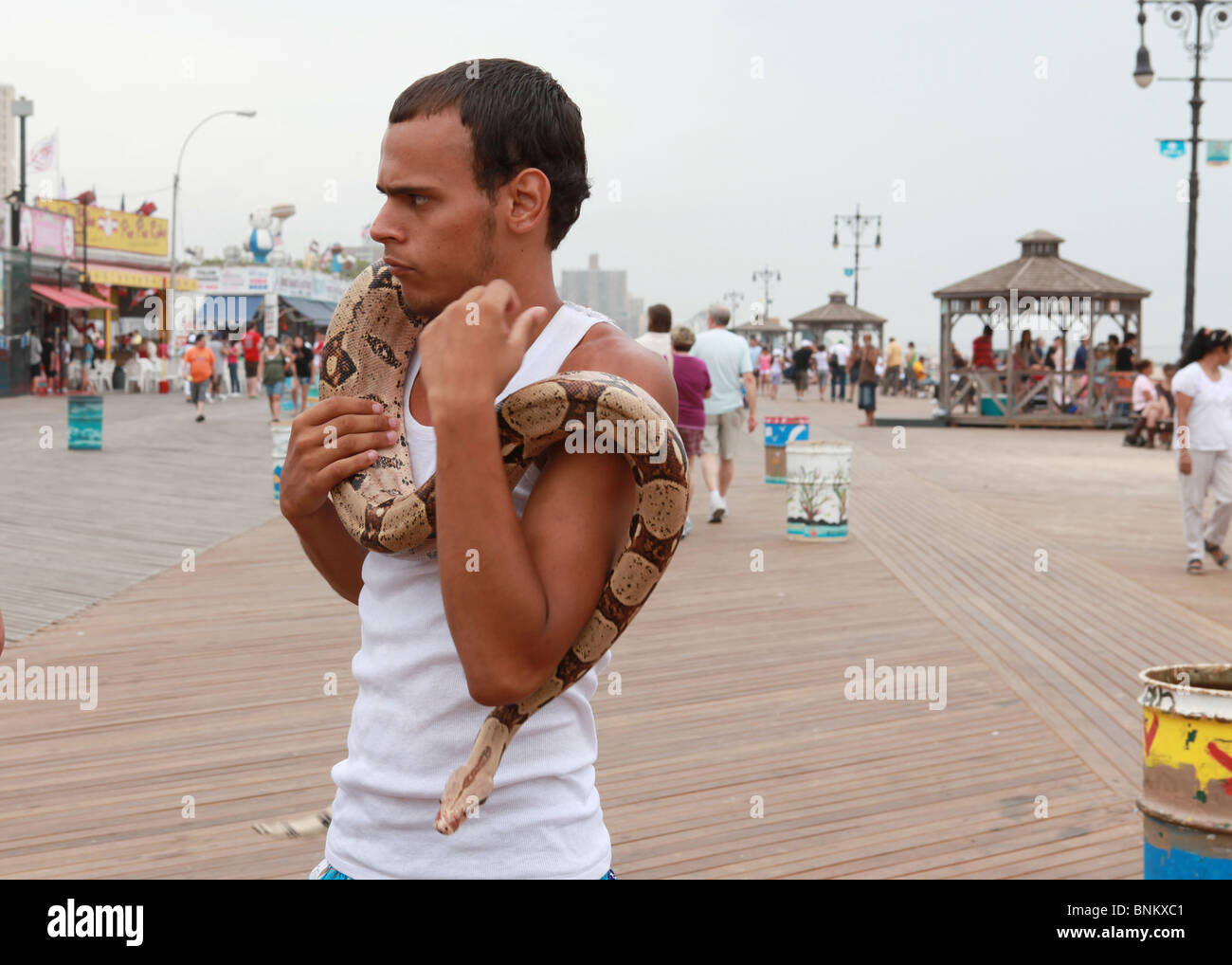 Angry man holding snake Stock Photo - Alamy