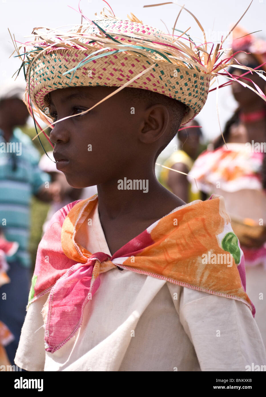 Young boy wearing his traditional straw hat, looking lost during the ...