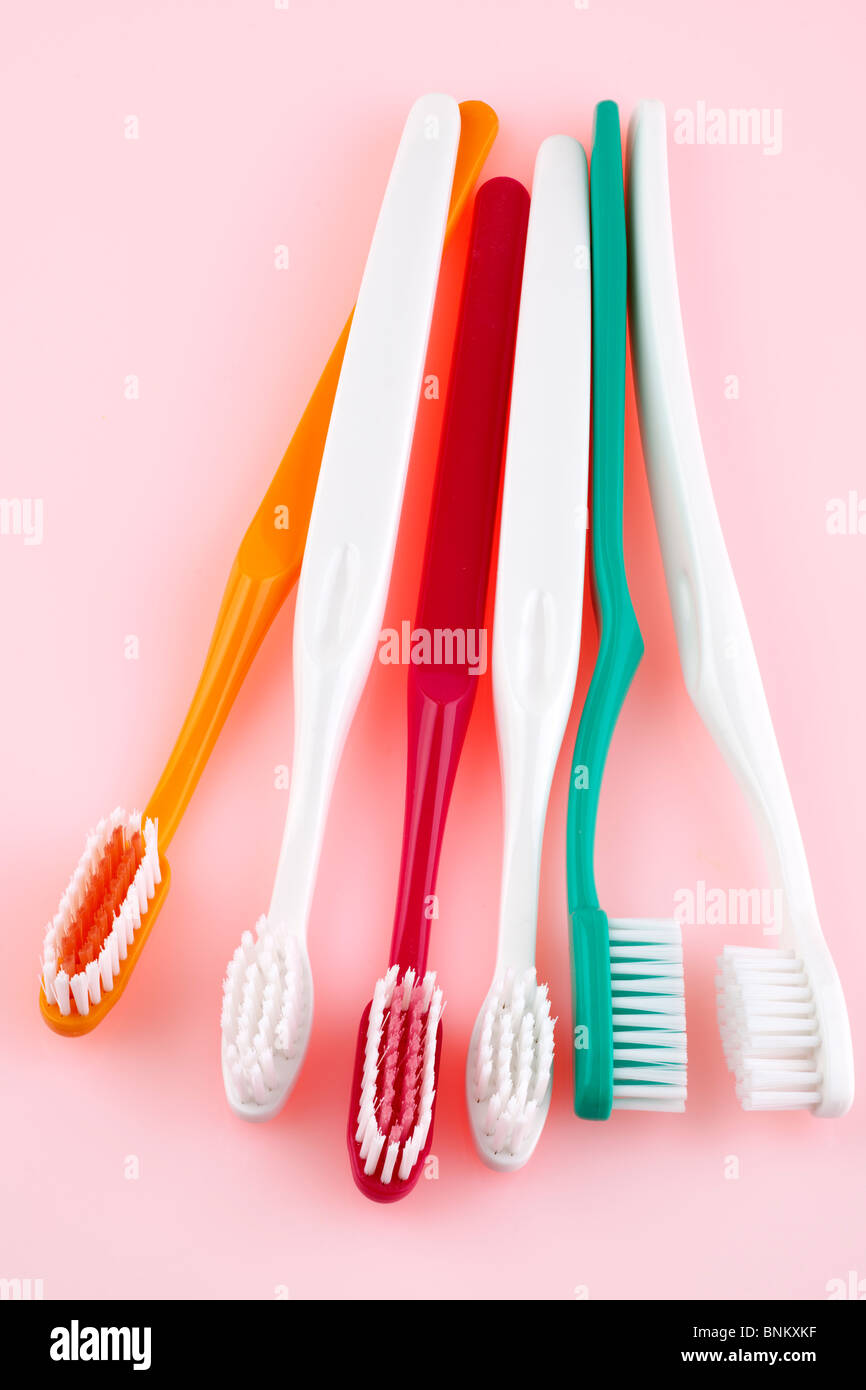 Six coloured toothbrushes Stock Photo - Alamy