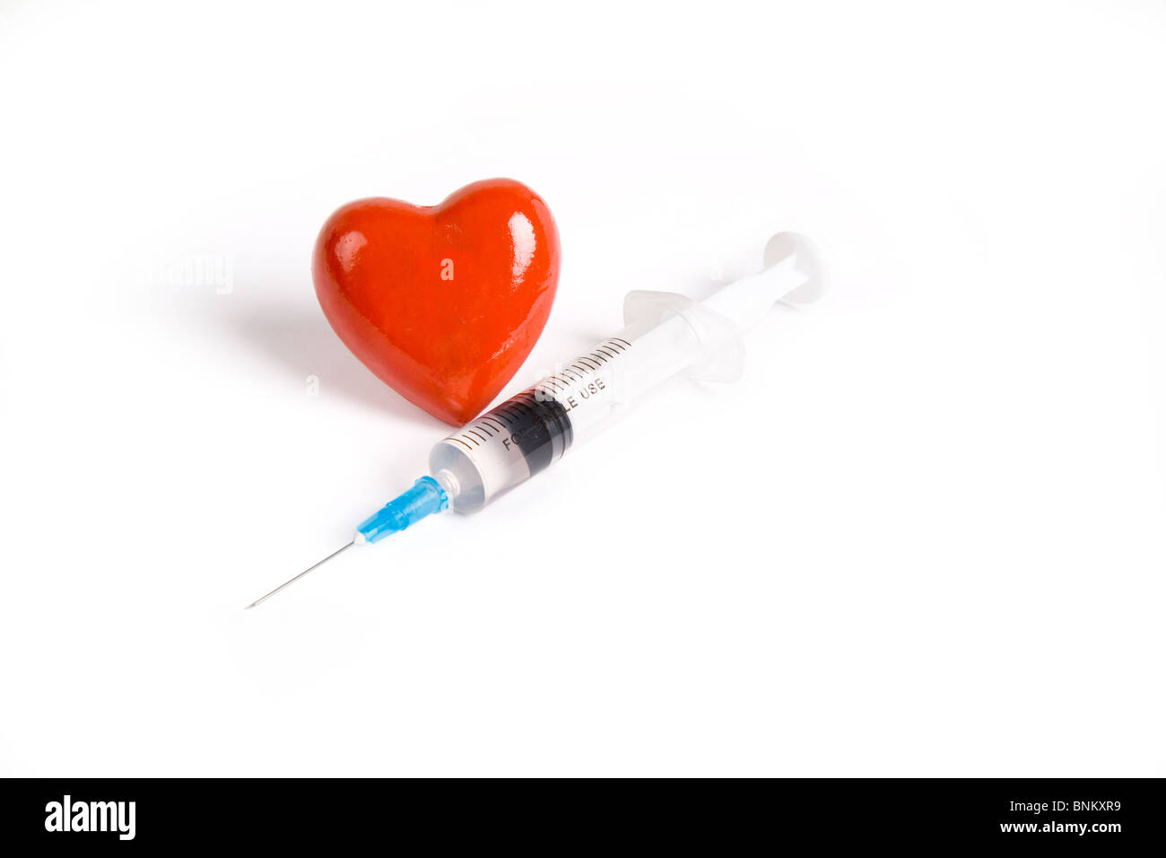 Heart syringe hi-res stock photography and images - Alamy