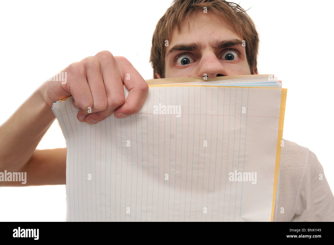 Student holding blank lined paper on white background Stock Photo - Alamy