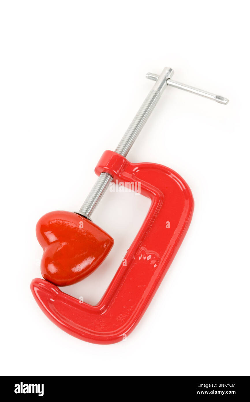 Vise Grip and red heart, concept of stress, sadness, heart broken, Pain ...