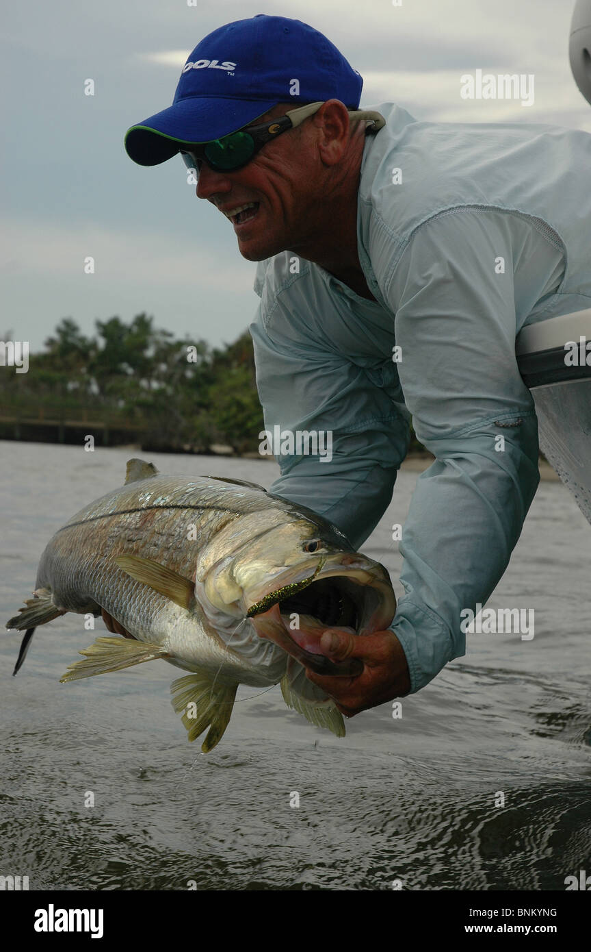 An inshore angler hefts a giant snook caught in Florida's Intracoastal ...