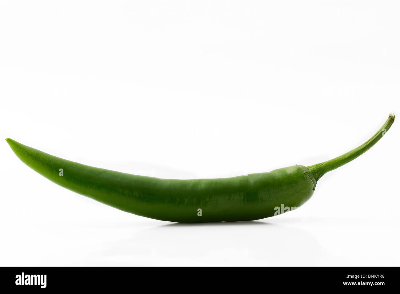one green chili isolated on white background Stock Photo - Alamy
