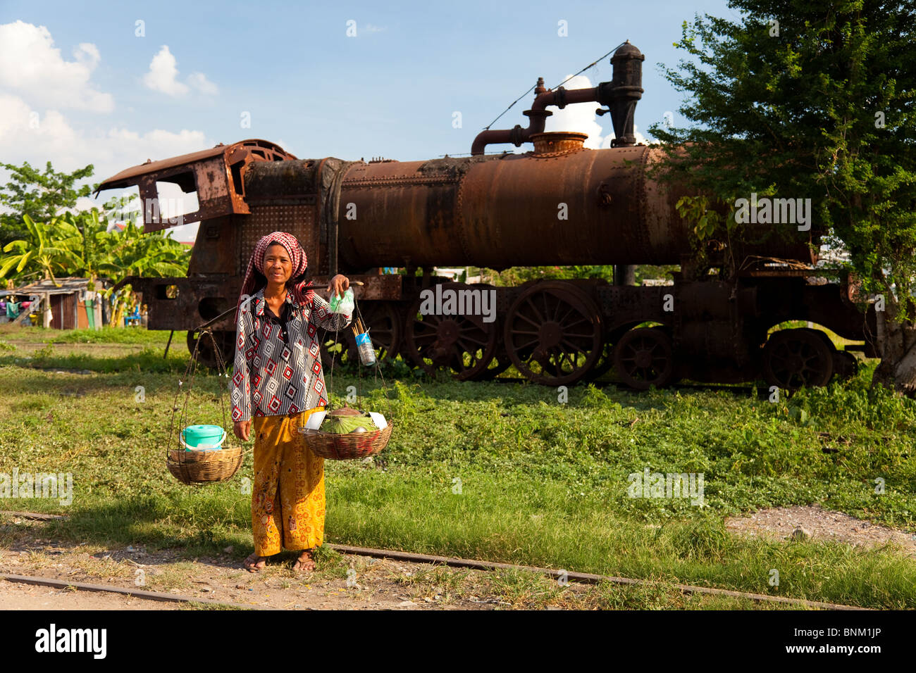 Khmer seller and rusty steam locomotive - Phnom Penh, Cambodia Stock ...