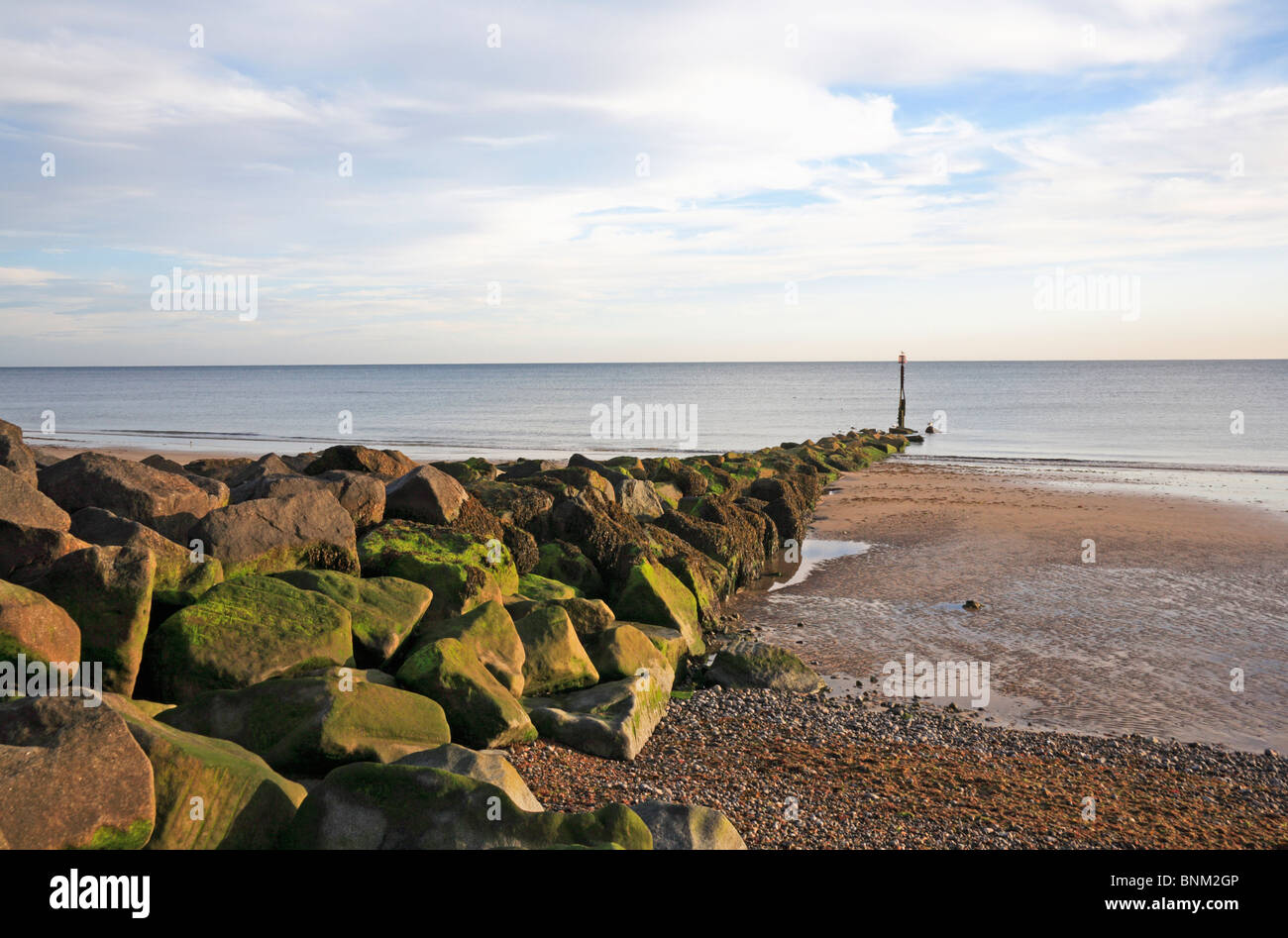 Rock breakwater at Sheringham, Norfolk, England, United Kingdom Stock ...